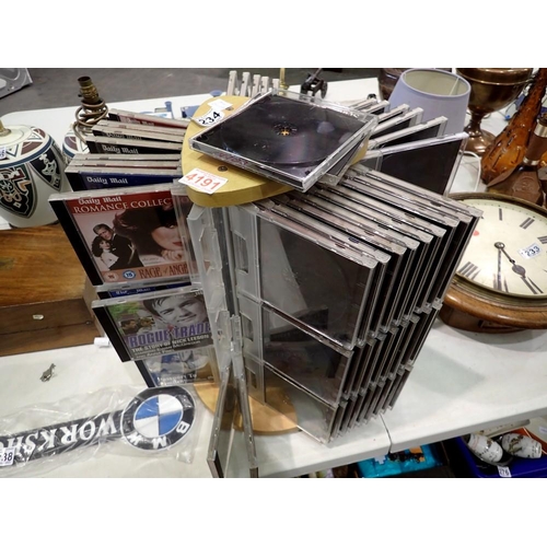 Rotating CD rack with DVDs. Not available for in-house P&P