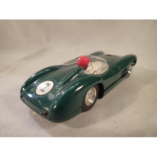Two Scalextric E2 Aston Martin with lights cars, one blue, one green ...