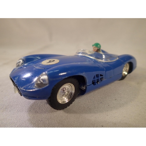 Two Scalextric E2 Aston Martin with lights cars, one blue, one green ...