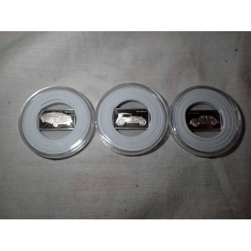 Three silver bullion car ingots, The Rover, 1925 Bentley and The ...