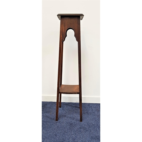 OAK TORCHERE with a square moulded top above an arched four sided ...