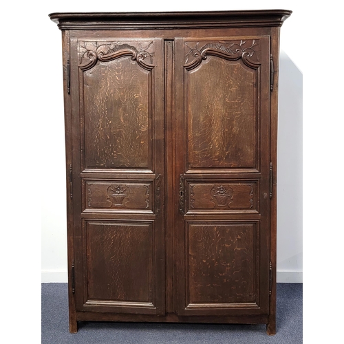 ANTIQUE RUSTIC OAK WARDROBE with cornice to top, the doors with carved ...