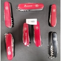 SEVEN VICTORINOX SWISS ARMY KNIVES of various sizes and designs Note ...