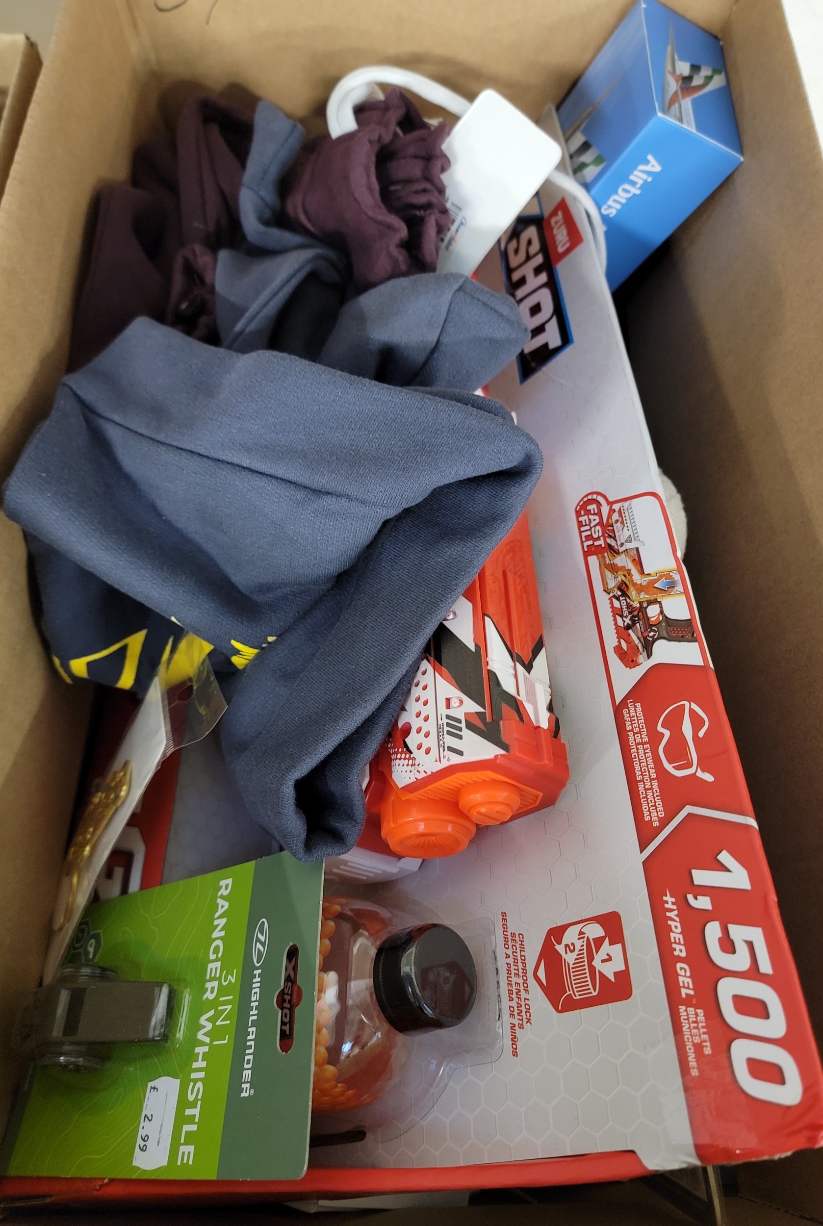 ONE BOX OF NEW ITEMS including: X-shot, baby accessories and airplane model