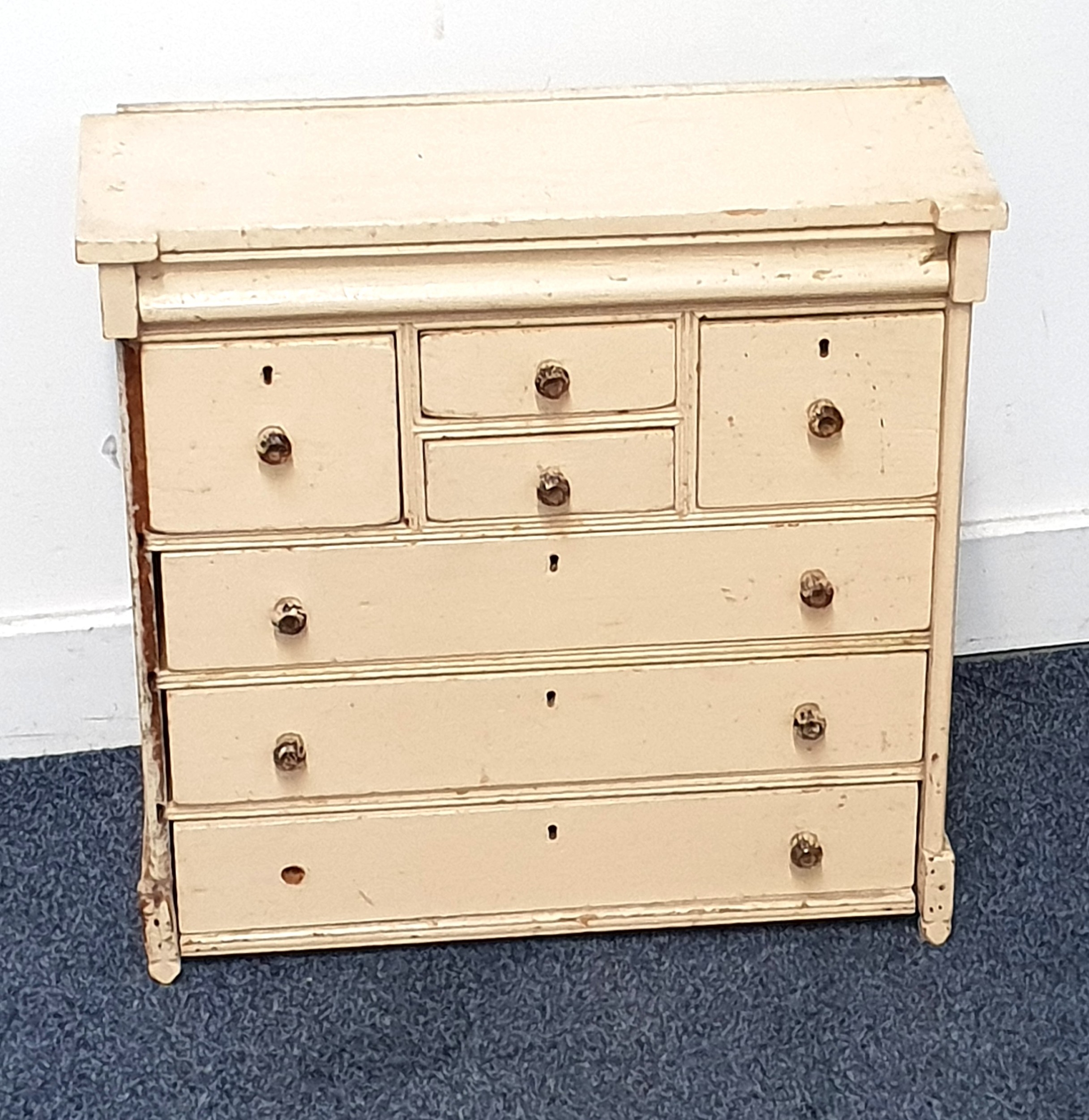 VINTAGE MINIATURE CHEST OF DRAWERS with an arrangement of four drawers ...