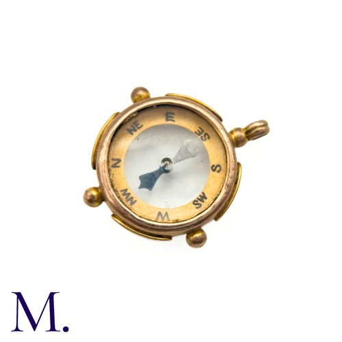 An Antique Compass Pendant in 9k yellow gold, the central compass ...