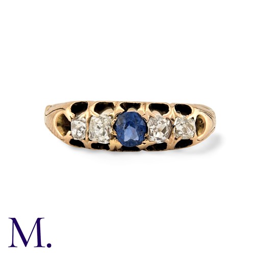 A Sapphire And Diamond Ring in 15k yellow gold, set centrally with a ...