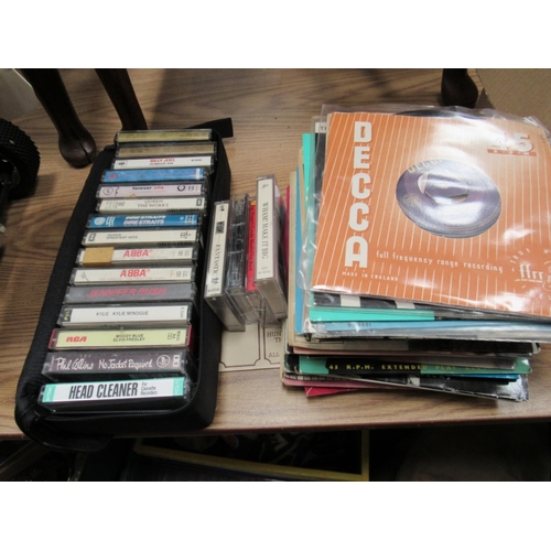 Old 45's records + cassettes