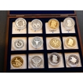 REPLICAS. "Famous US Coin Replicas", collection of twelve silver-plated ...