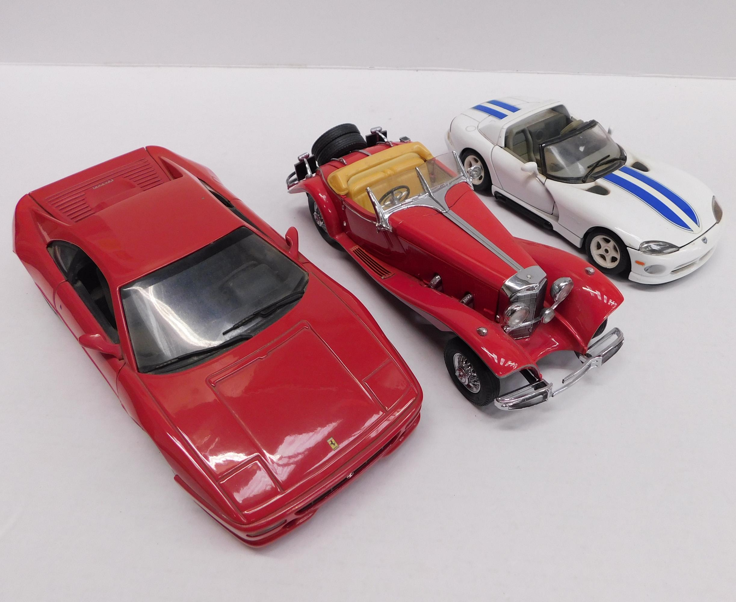 Three - 1/18 scale die cast model cars