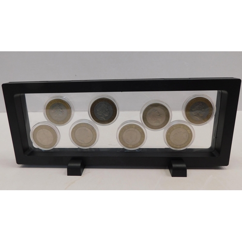 Eight collectable £2 coins - in display cases