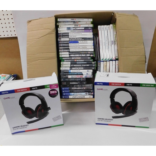 Two gaming headsets and box of mixed console games