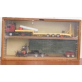 Two large scale model lorries with display case - approx. 30" x 16"