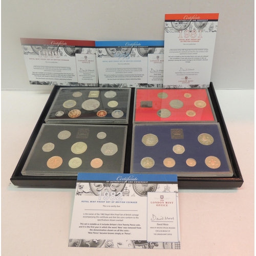 Four London mint coin sets in display case - 1981, 1995, 1989, and 1982