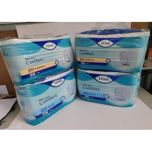 4 new packs of Tena pads