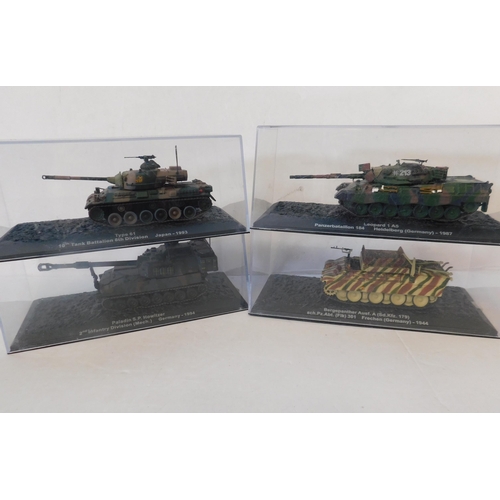 Four boxed tank models