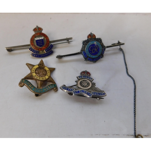 Four military badges - three silver