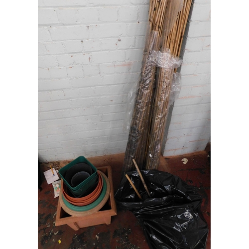 Large amount of garden canes (two sizes) and plastic planters
