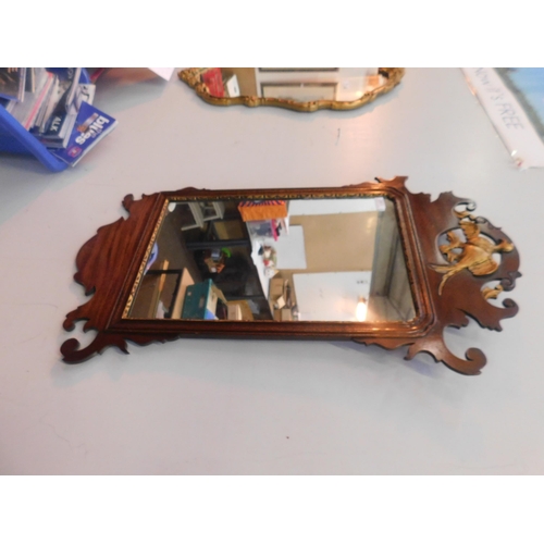 Antique mahogany fretwork mirror with gilt bird finial