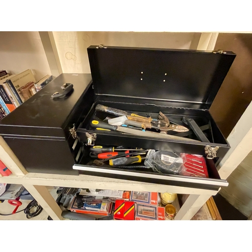 Three metal tool boxes with tools.