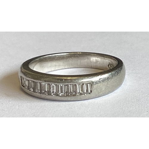 A good quality baguette cut single row ring in platinum rub-over mount ...