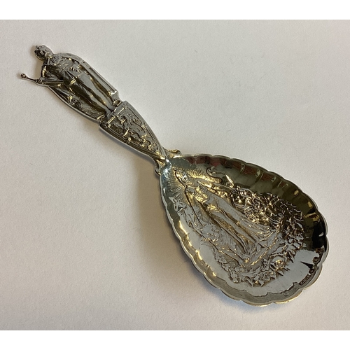 EDINBURGH: A large commemorative silver caddy spoon with chased ...