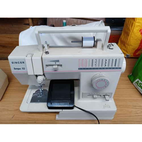 A Singer Tempo 70 sewing machine with foot pedal