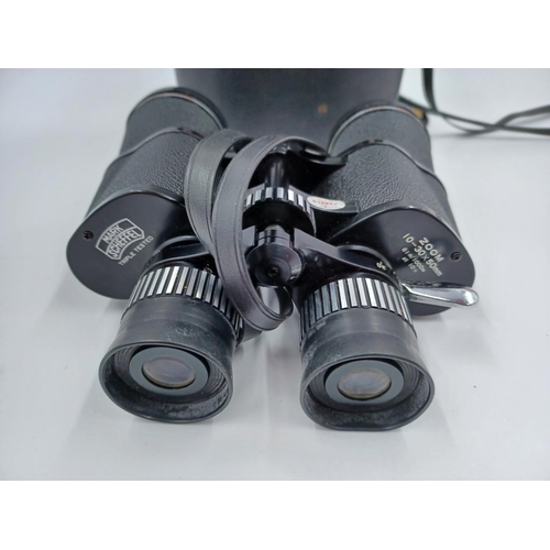 A cased pair of Mark Scheffel 10-30 x 50mm binoculars