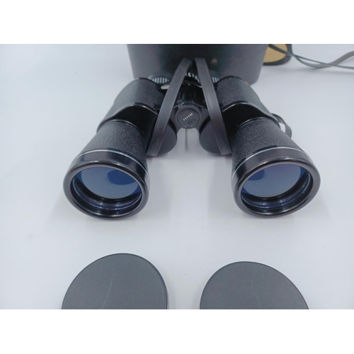 A cased pair of Mark Scheffel 10-30 x 50mm binoculars