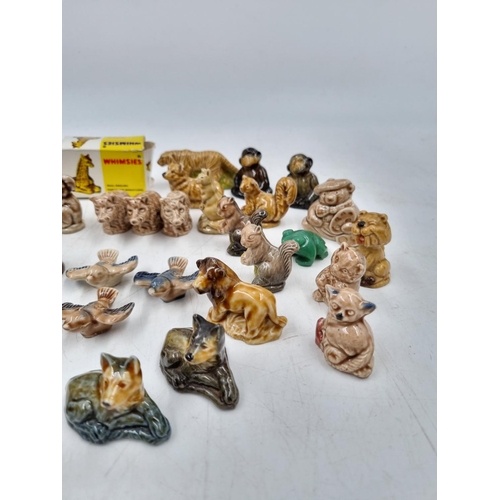 A large collection of assorted mostly Wade Whimsies ceramic animal ...