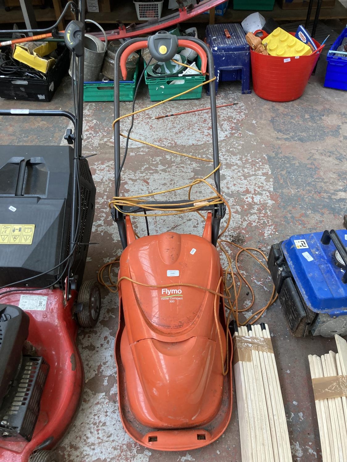 A Flymo Hover Compact 300 electric lawnmower