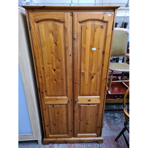 A modern pine double wardrobe - approx. 18cm high x 90cm wide x 60cm deep
