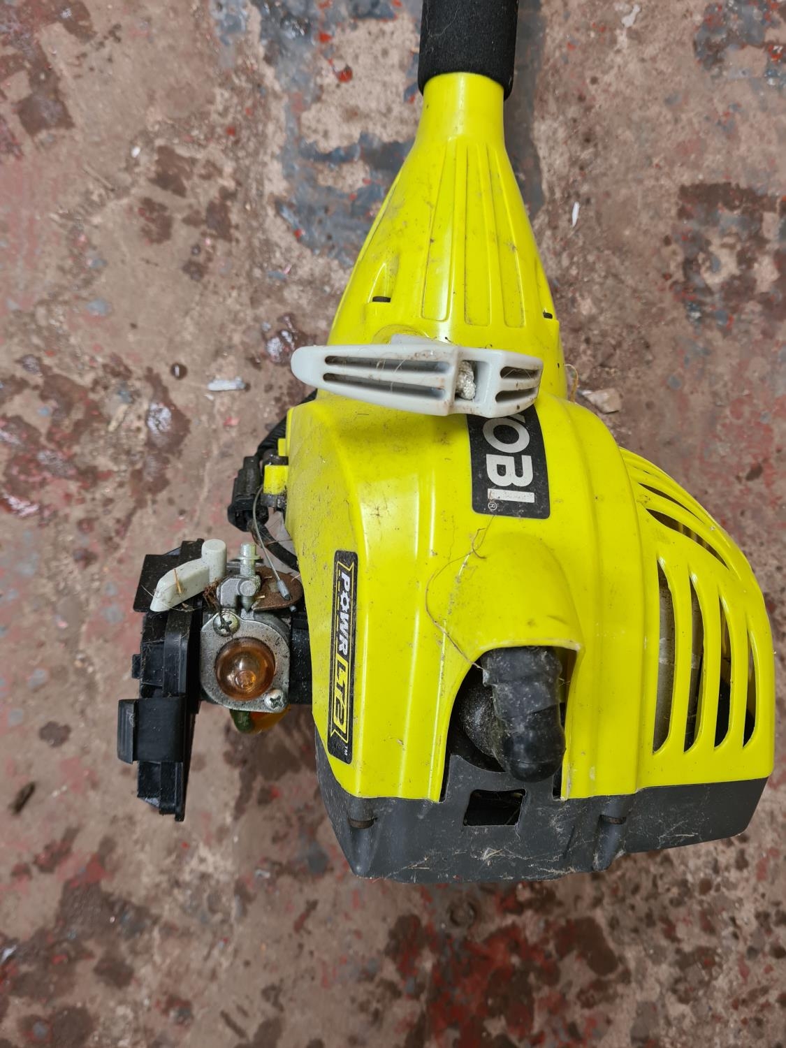 A Ryobi Powr LT2 petrol powered strimmer