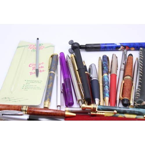 A collection of forty five assorted writing instruments to include ...