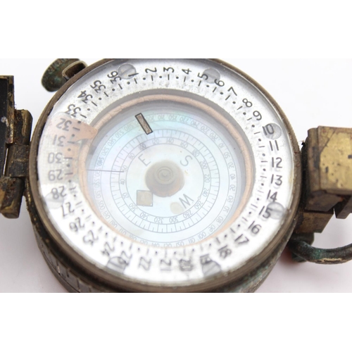 A WWII T.G & Co. of London British military compass, dated 1944 ...