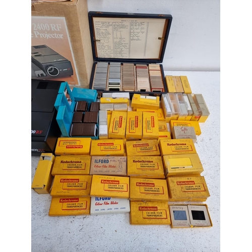 A boxed Boots 2400RF slide projector with a large collection of slides ...