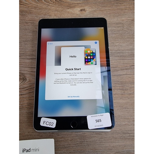 Two Apple iPad Mini tablets, one A1489 and one A1538