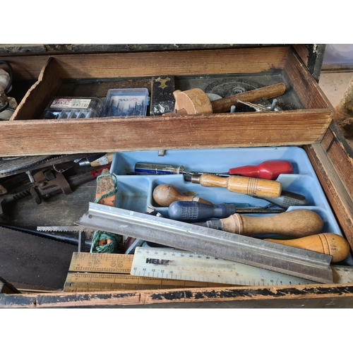 An early 20th century ebonised pine carpenters tool chest containing ...