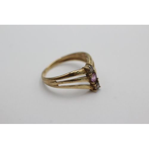 A 9ct gold amethyst and diamond three stone split band ring, size M ...
