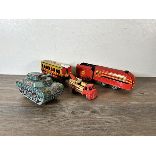 Four vintage tinplate model vehicles to include the Prince clockwork ...