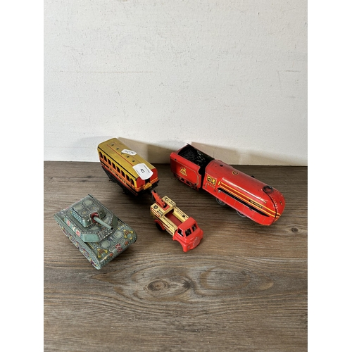 Four vintage tinplate model vehicles to include the Prince clockwork ...