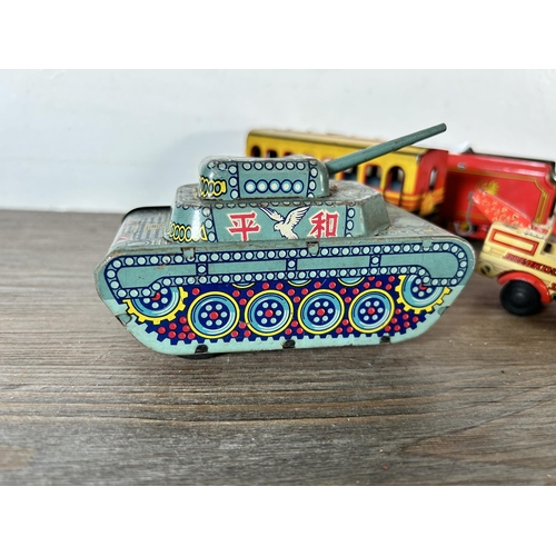 Four vintage tinplate model vehicles to include the Prince clockwork ...