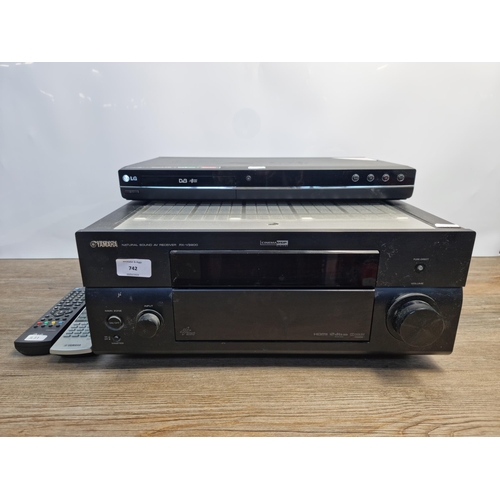 Two items with remote controls, one Yamaha RX-V3900 AV receiver and one ...