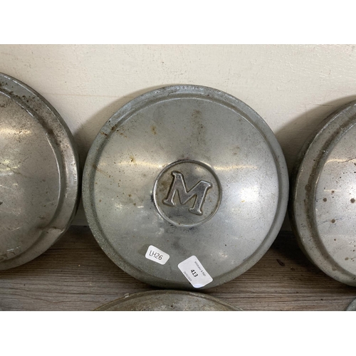 Nine items, four Morris Minor hub caps, three Austin Healey hub caps ...
