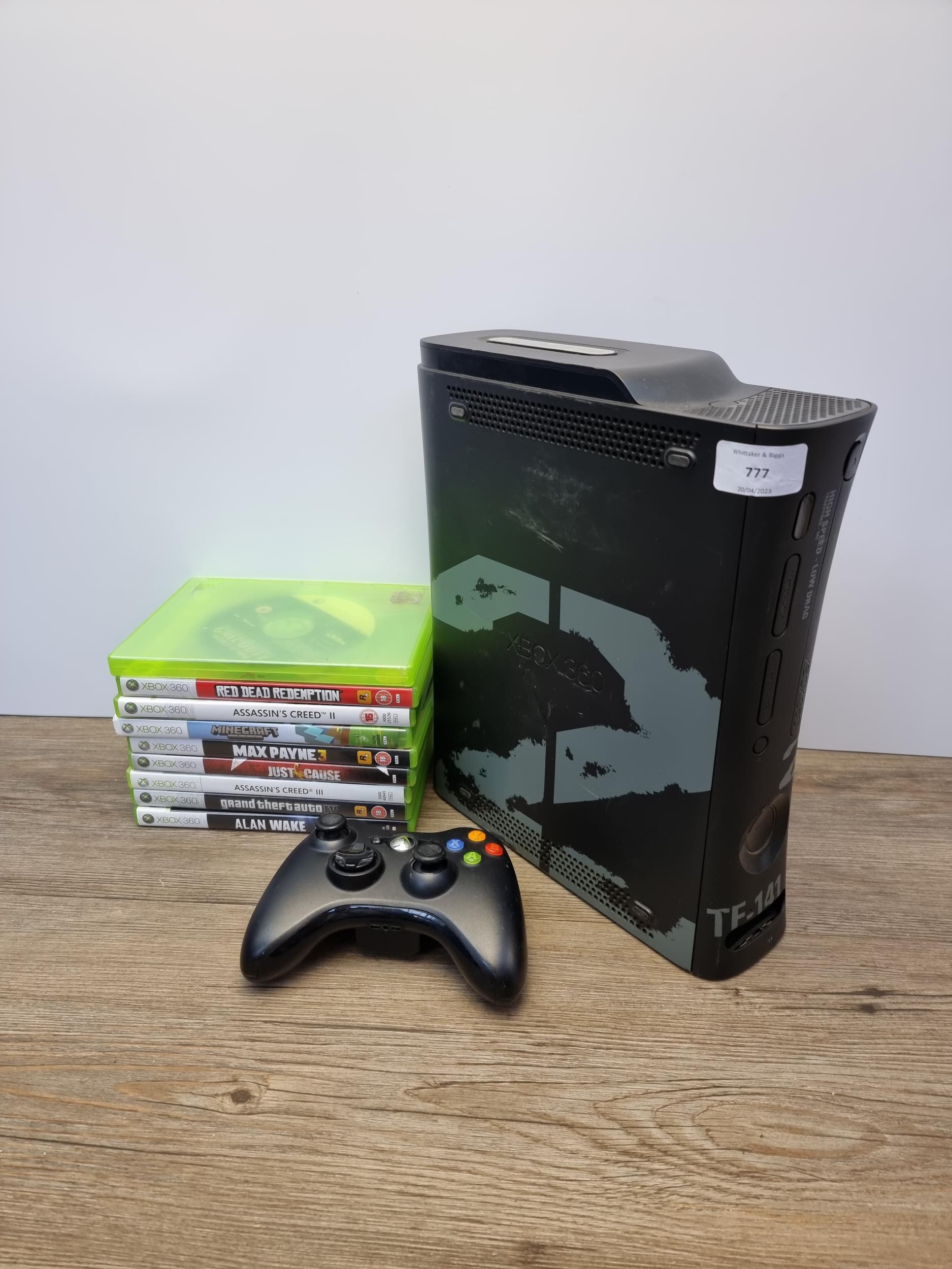 A Microsoft Xbox 360 Elite COD: MW2 limited edition console with games ...
