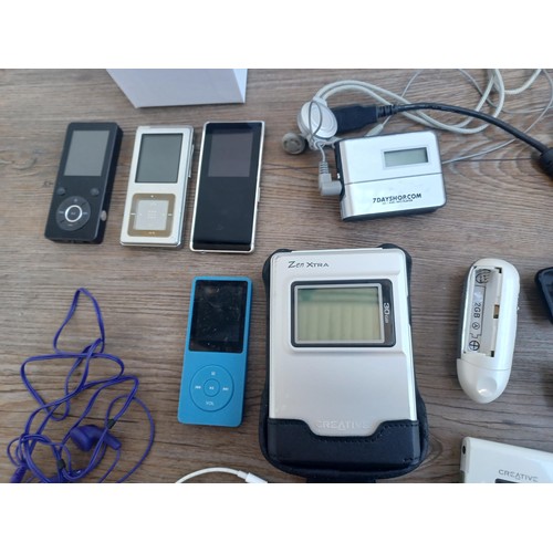A collection of personal digital media players to include Creative Zen ...