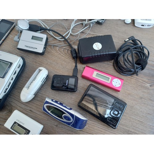 A collection of personal digital media players to include Creative Zen ...