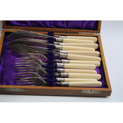 Three vintage boxed cutlery sets