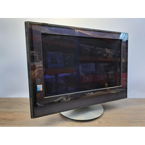 A Sony VAIO all in one desktop computer together with Logitech wireless ...