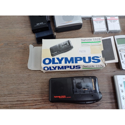 A collection of voice recorders to include Olympus digital, Sony microcassette with sealed blank med